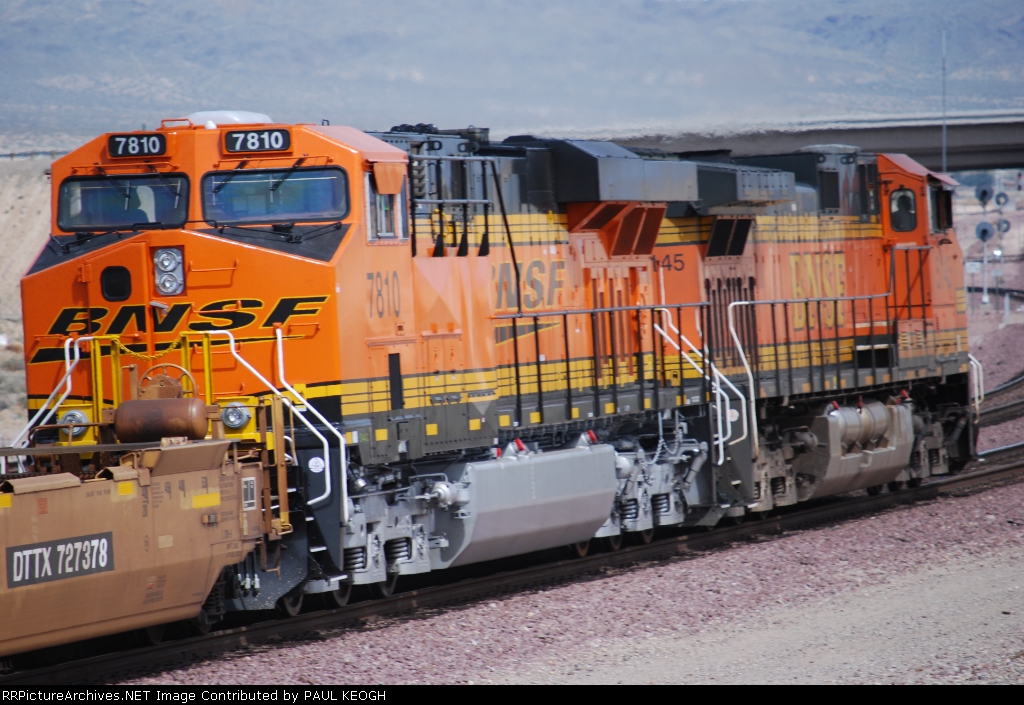 BNSF 7810 rolls into the BNSF Barstow Depot behind BNSF 5145 as they both pull a load of empty ...